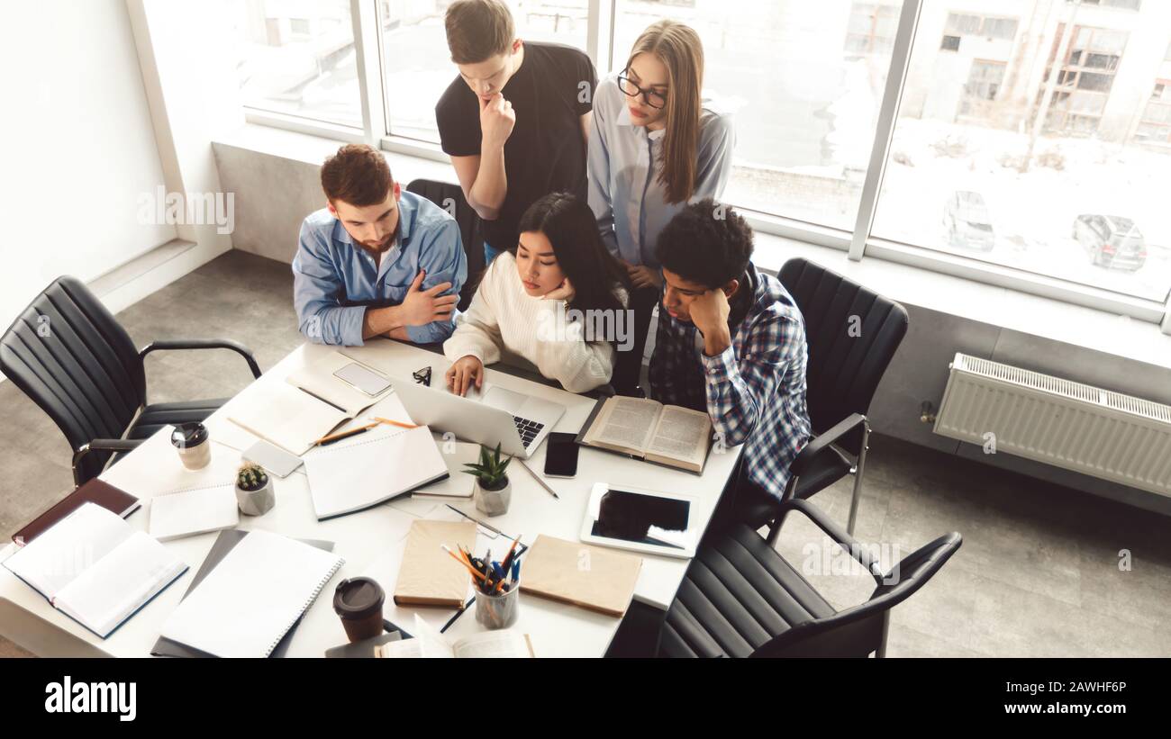 Exam preparation. Students studying together in library Stock Photo - Alamy