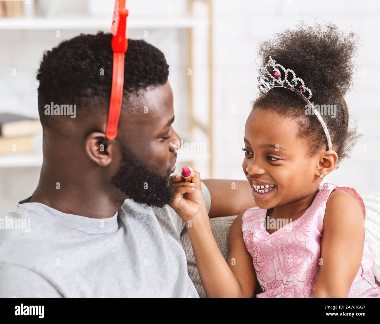Close up of fancy father and daughter wearing make up Stock Photo - Alamy