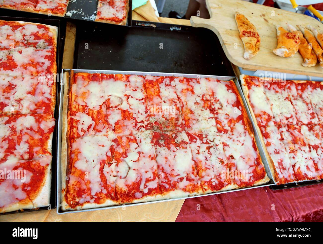 Street food stall with many Italian foods including Pizza and ...