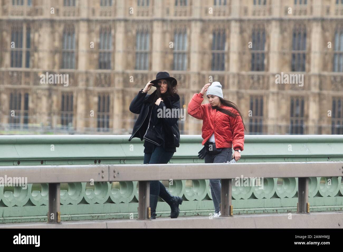 LONDON, UK - 9 February 2020: Pedestrians brave the high winds and ...
