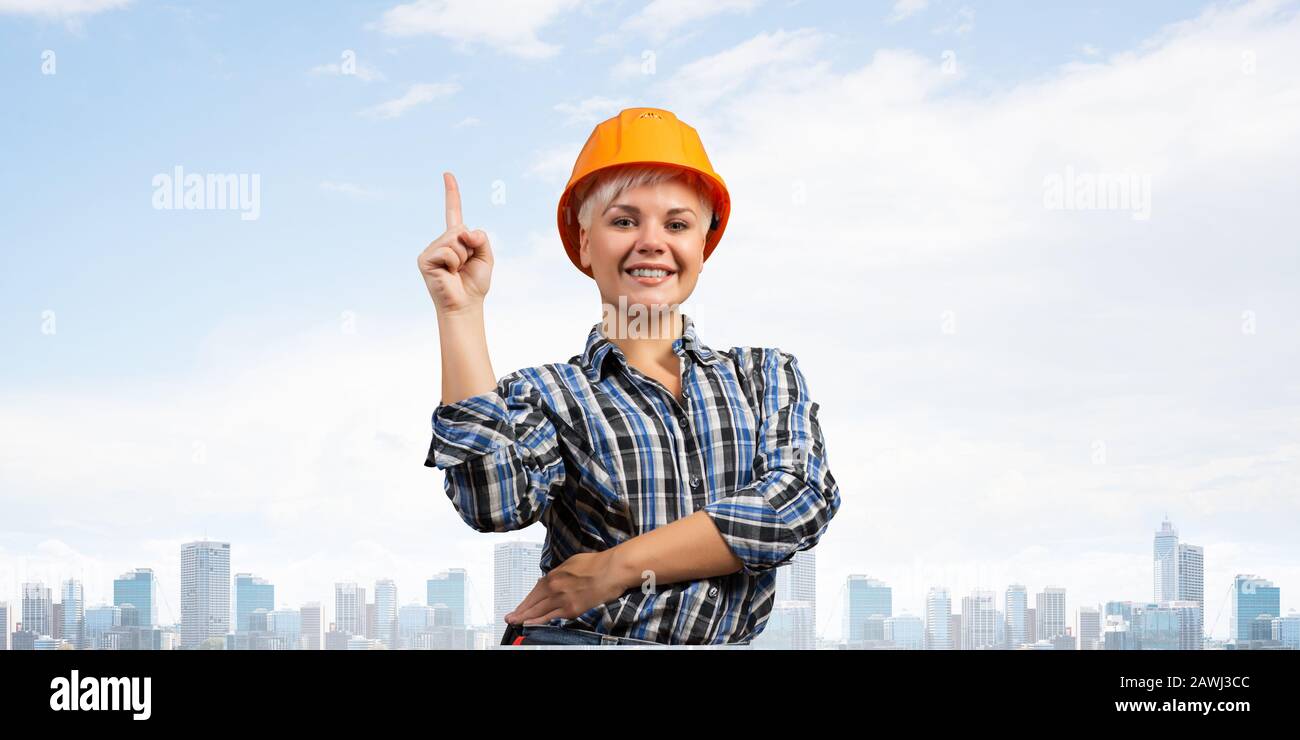 Beautiful female builder in hardhat Stock Photo - Alamy