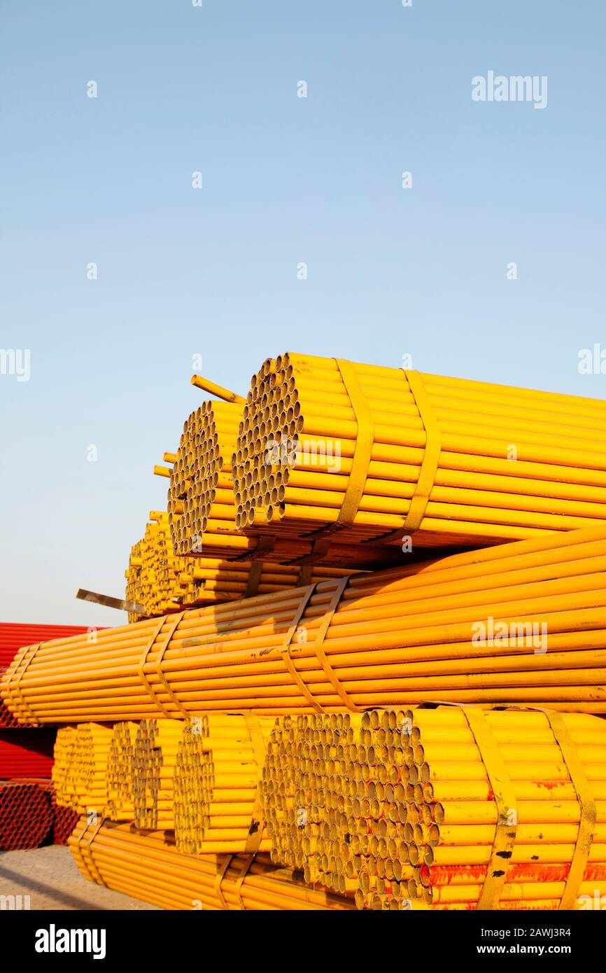 Steel pipe piled up together Stock Photo - Alamy