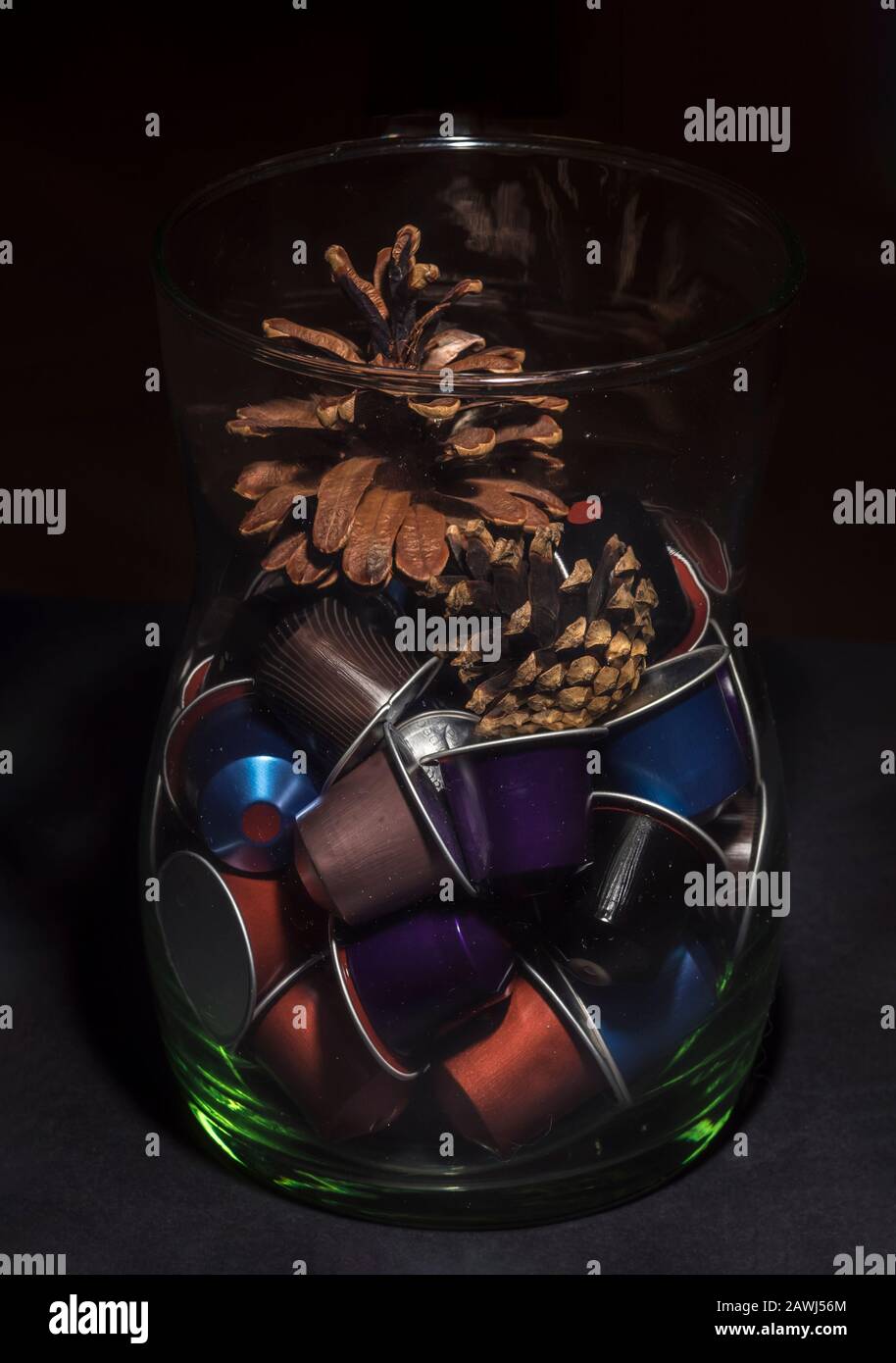 Coffee capsule jar on a black background Stock Photo - Alamy