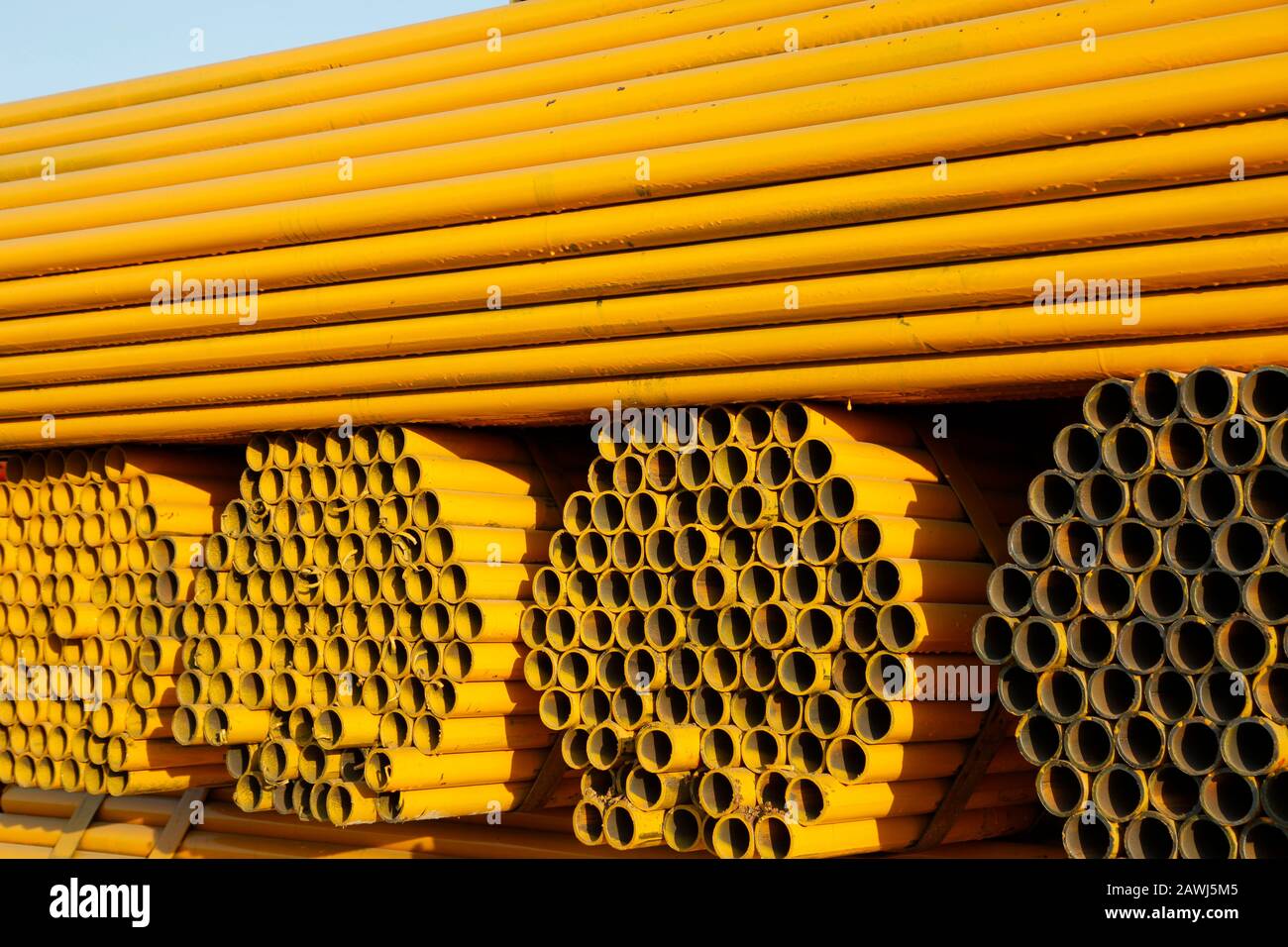 Steel pipe piled up together Stock Photo - Alamy