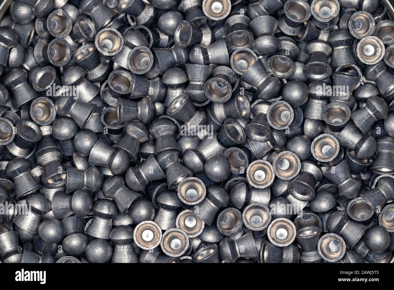 Thick layer of lead air gun slugs macro Stock Photo - Alamy