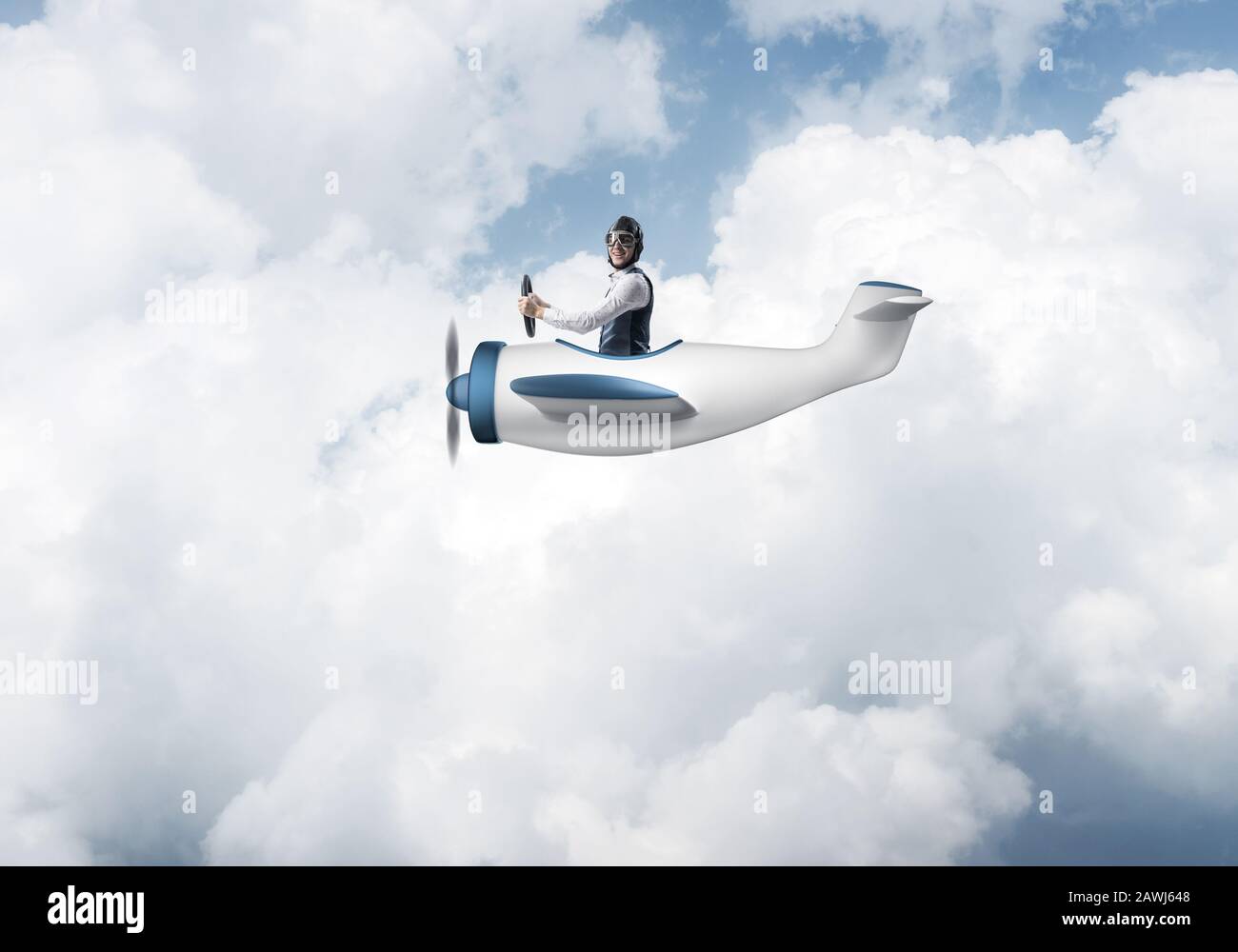 Happy pilot driving small propeller plane Stock Photo - Alamy