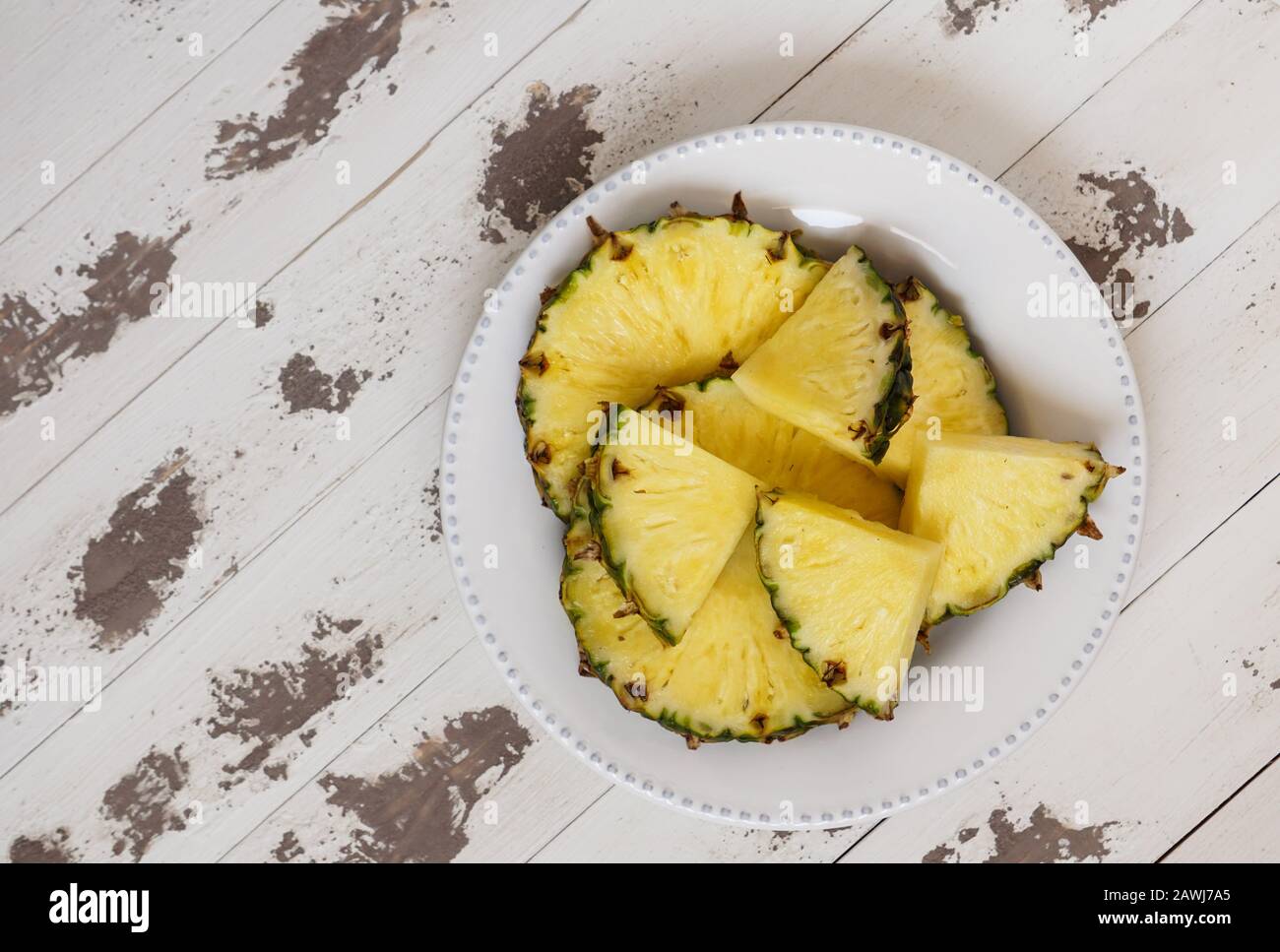 fresh pineapple cutted on the old painted white wood Stock Photo - Alamy