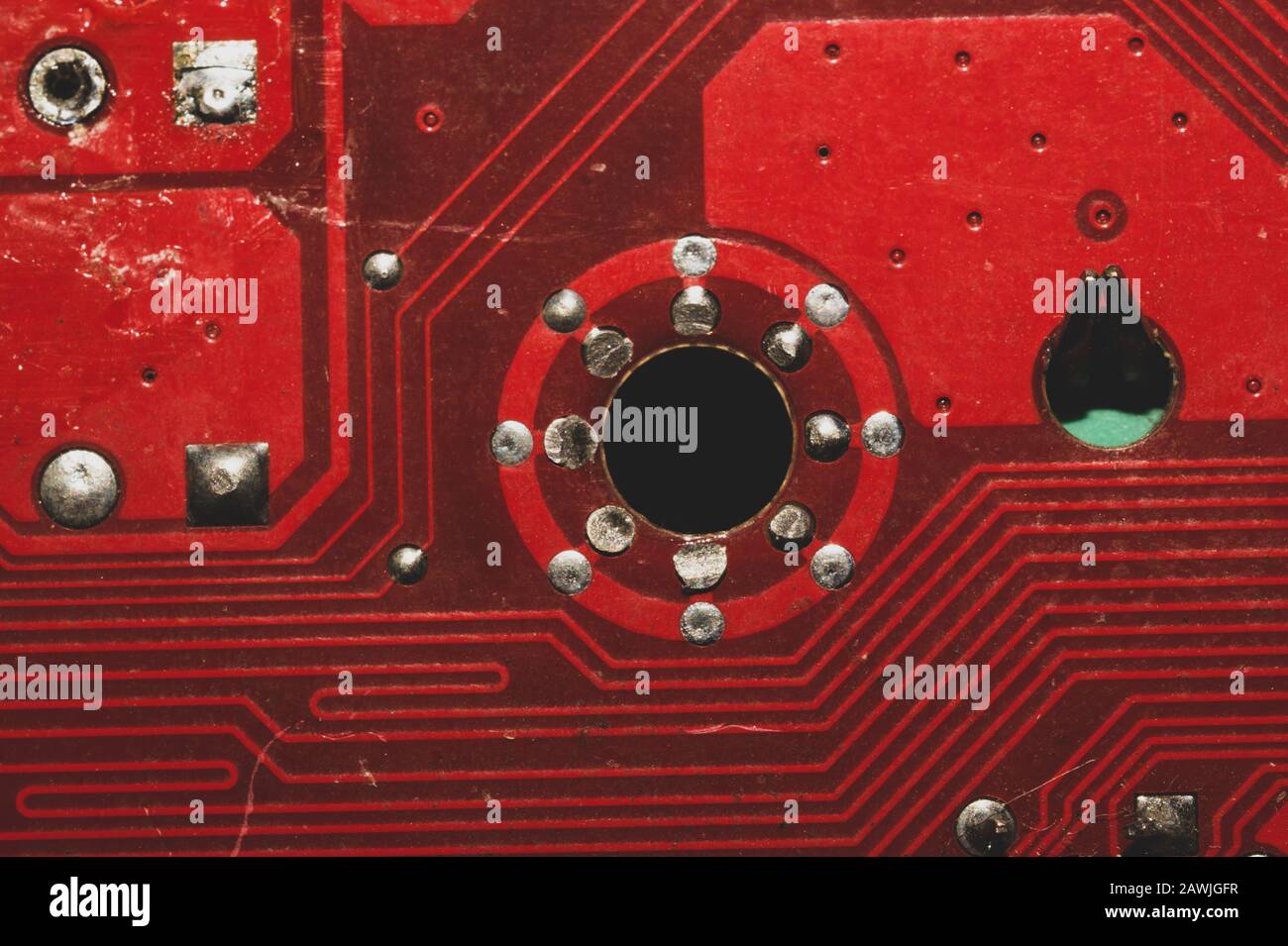 Spoiled motherboard close up. circuit board with dust and defects ...