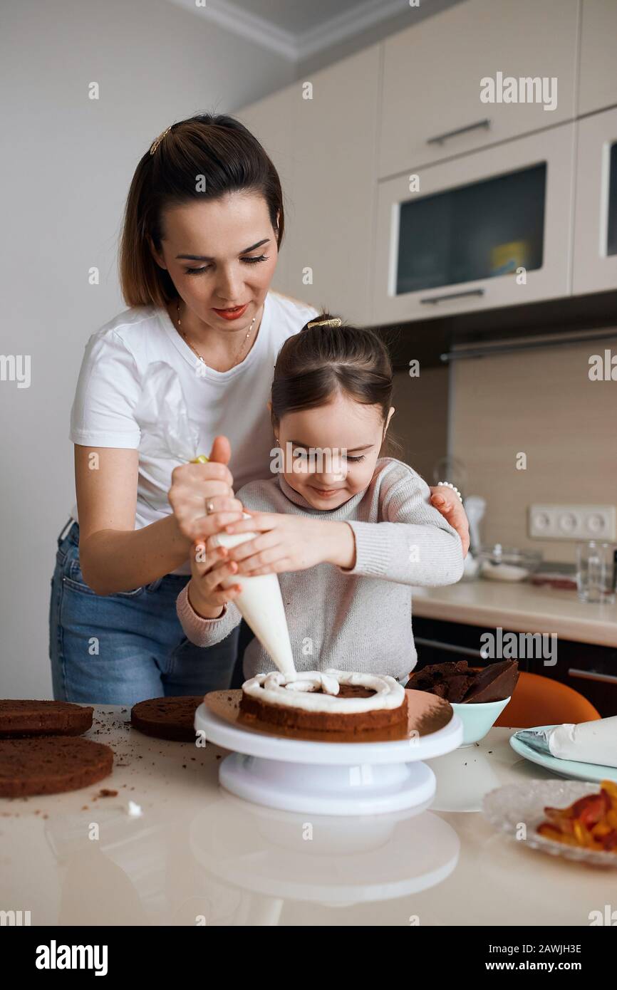 little talented girl learning to make cake, close up photo. first ...
