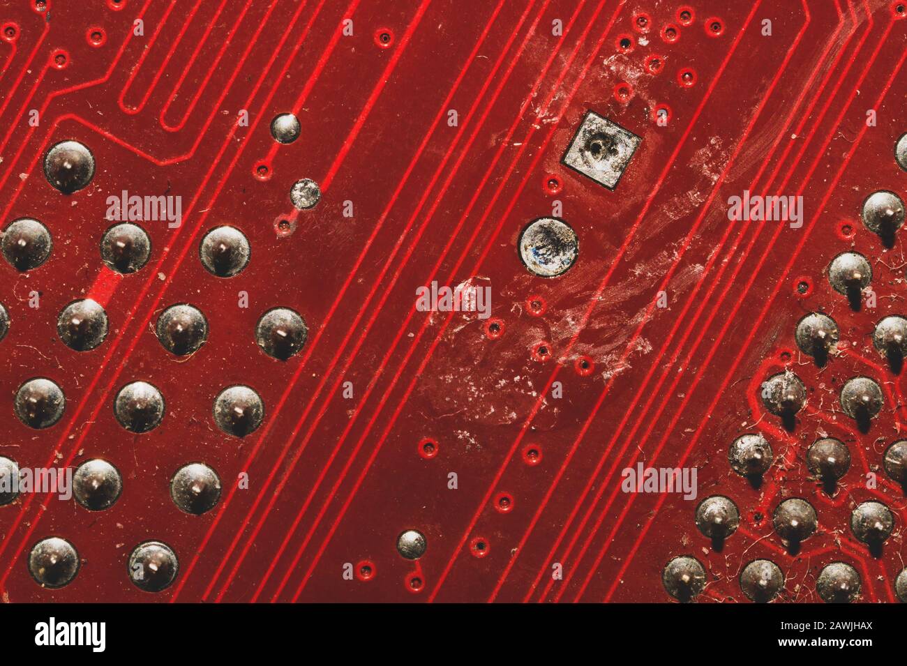 Spoiled motherboard close up. circuit board with dust and defects ...