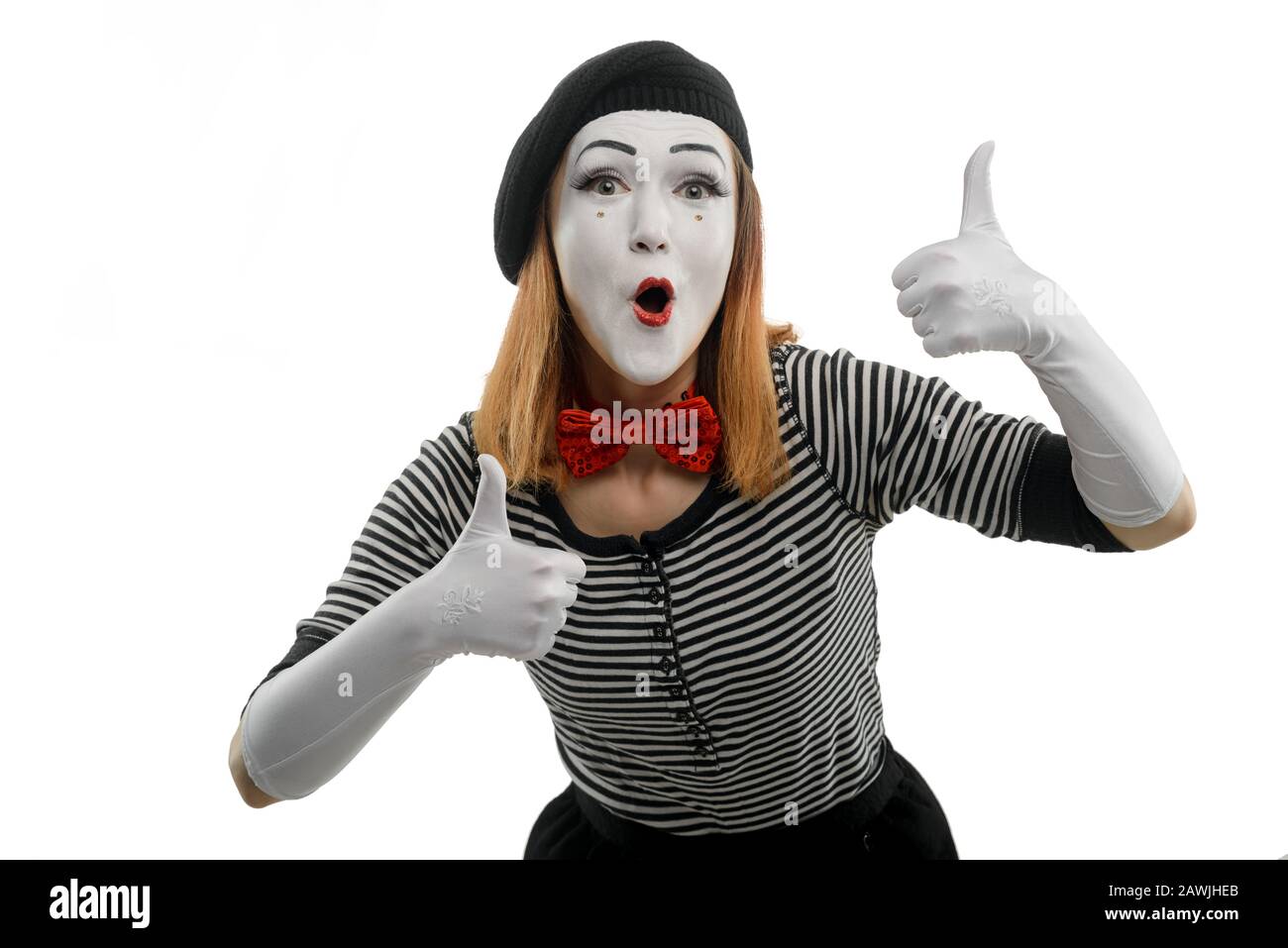Female mime shows thumbs up of both hands Stock Photo - Alamy