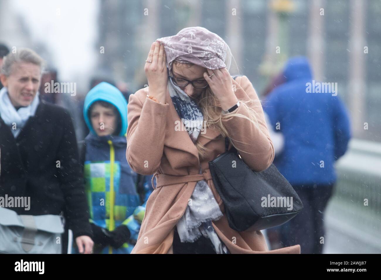 LONDON, UK - 9 February 2020: Pedestrians brave the high winds and ...