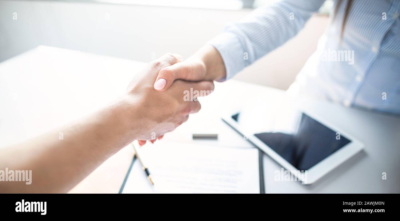 Business people shaking hands, finishing up a meeting Stock Photo - Alamy