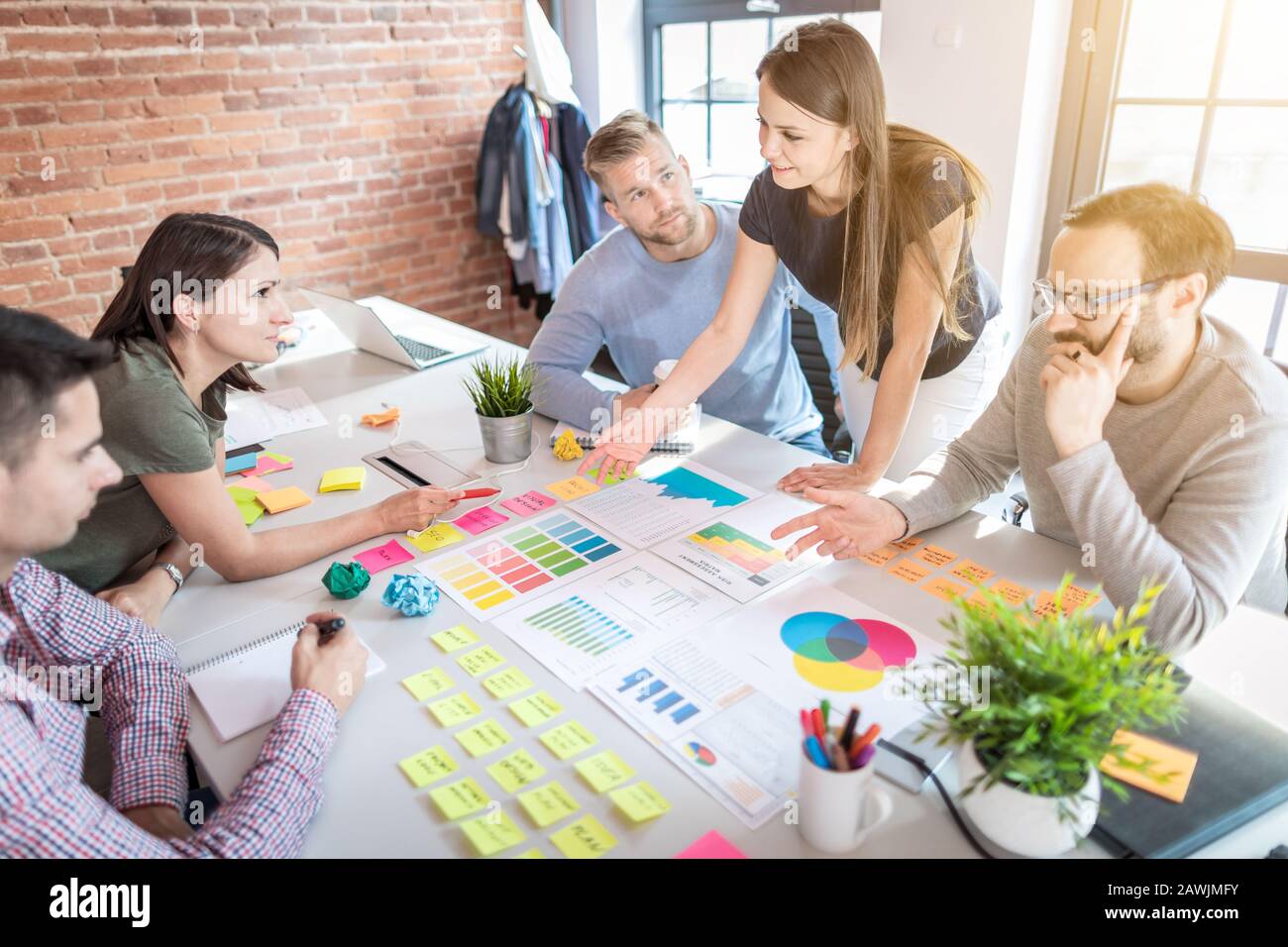 Business people meeting at office and use post it notes to share idea ...