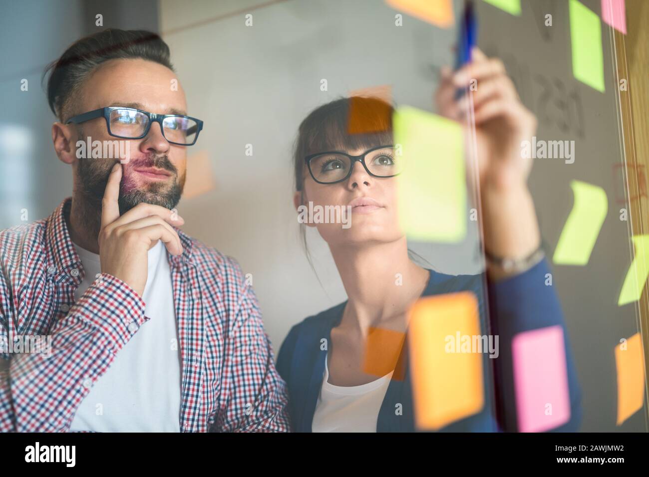 Business people meeting at office and use post it notes to share idea ...