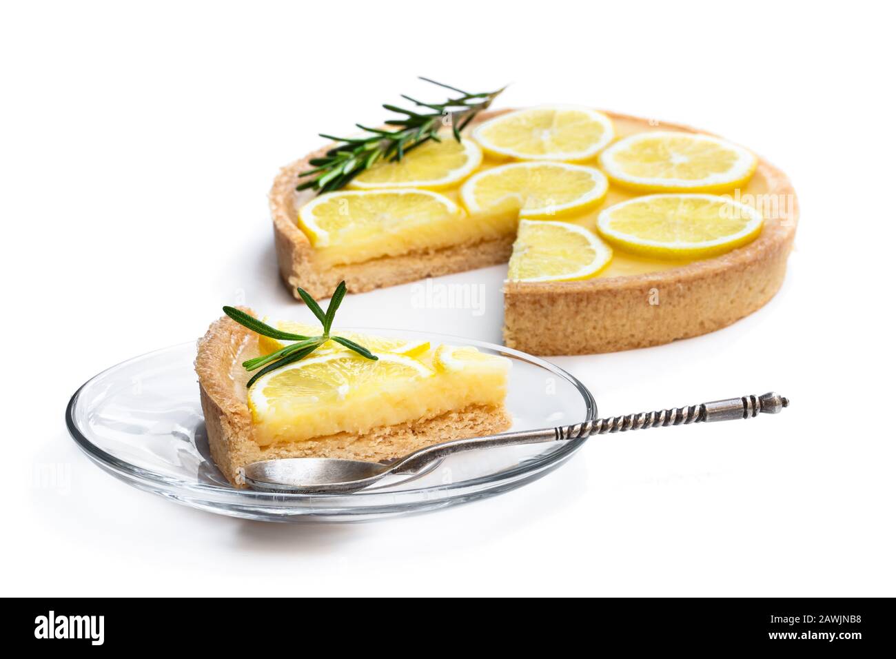 Traditional french lemon tart with rosemary leaves isolated on white ...