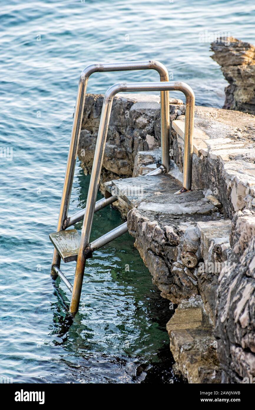 Metallic ladder on the beach, Solta, Croatia. Summer vacation Stock ...