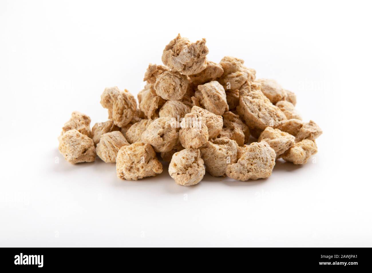 Heap of dry soy meat isolated on white background Stock Photo - Alamy
