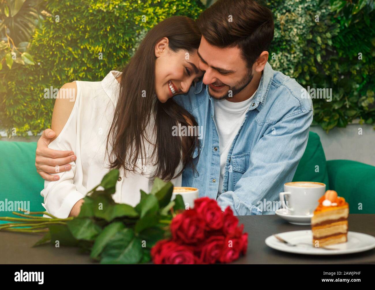 Lovely Couple Hugging Having Romantic Date Sitting In Cafe Stock Photo ...