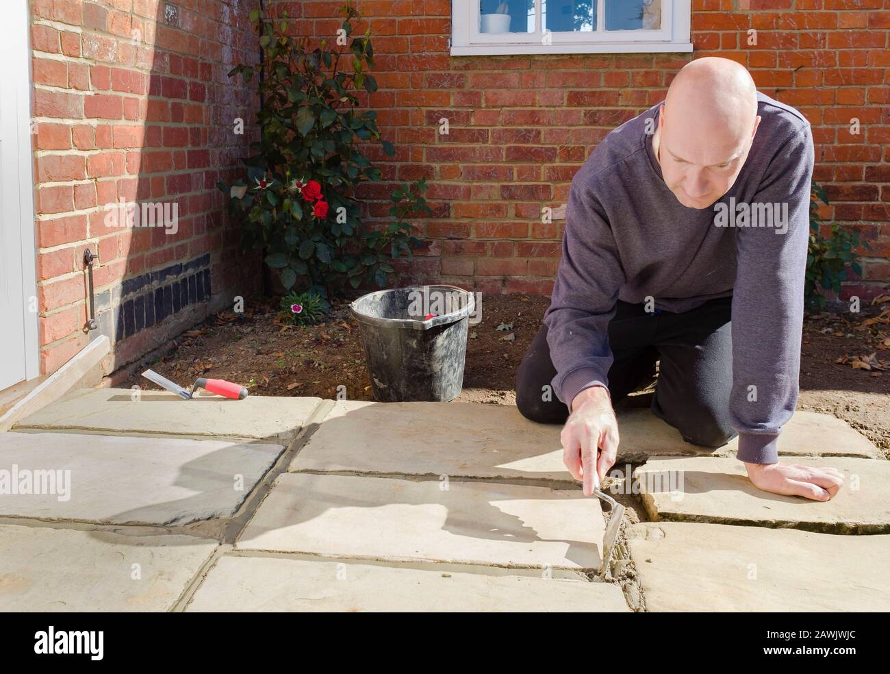 Paving slabs laying hi-res stock photography and images - Alamy