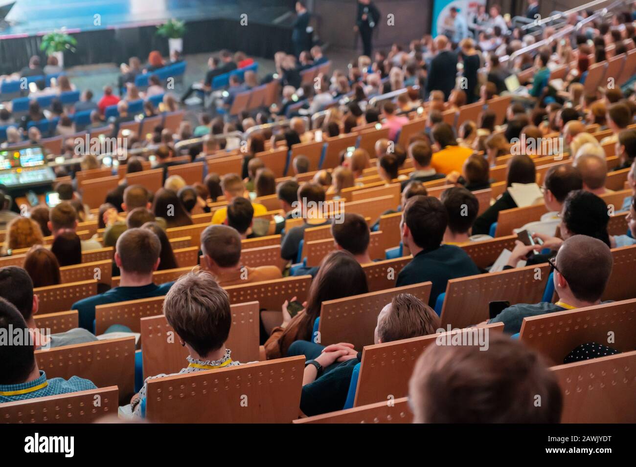 Business conference attendees sit and listen Stock Photo - Alamy