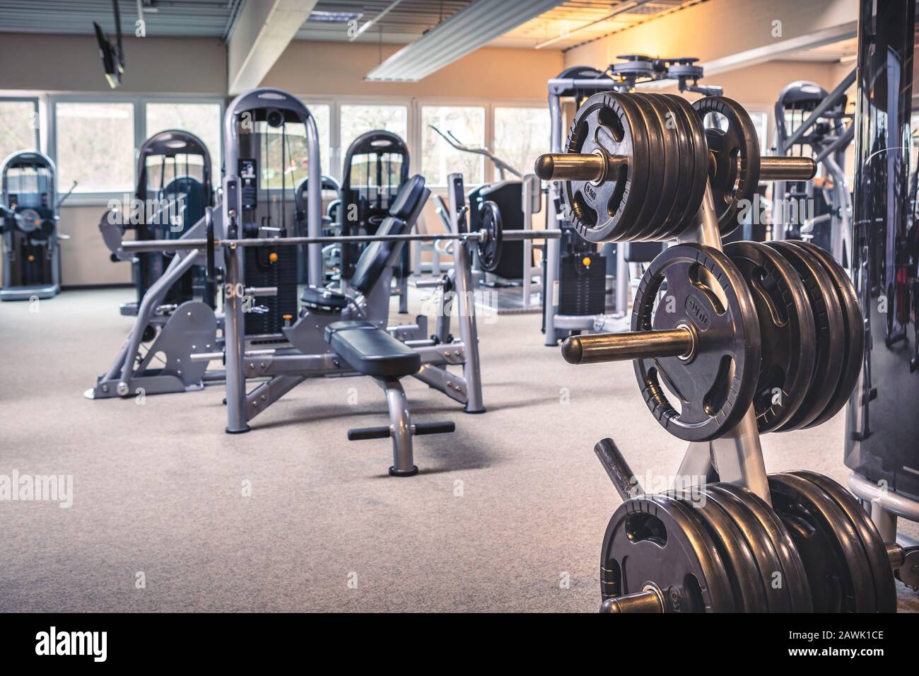 diverse equipment and machines at the gym room Stock Photo - Alamy