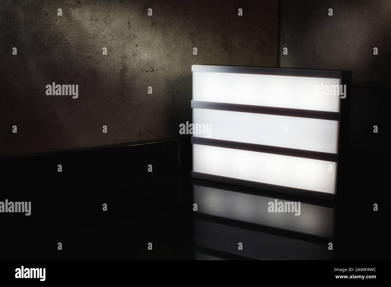 An empty blank light box in a cinematic moody background Stock Photo ...