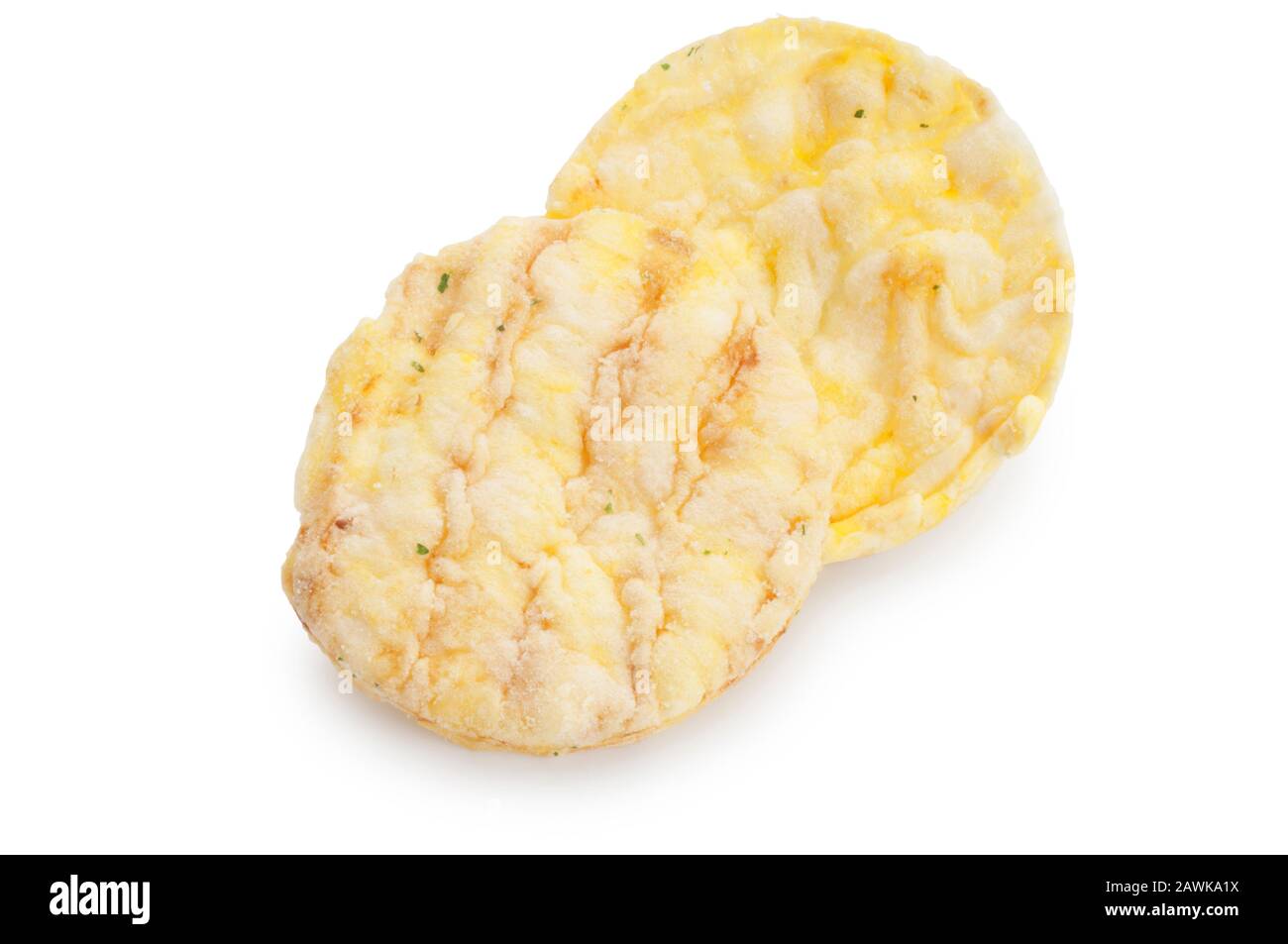 Studio shot of circular corn crisps cut out against a white background ...