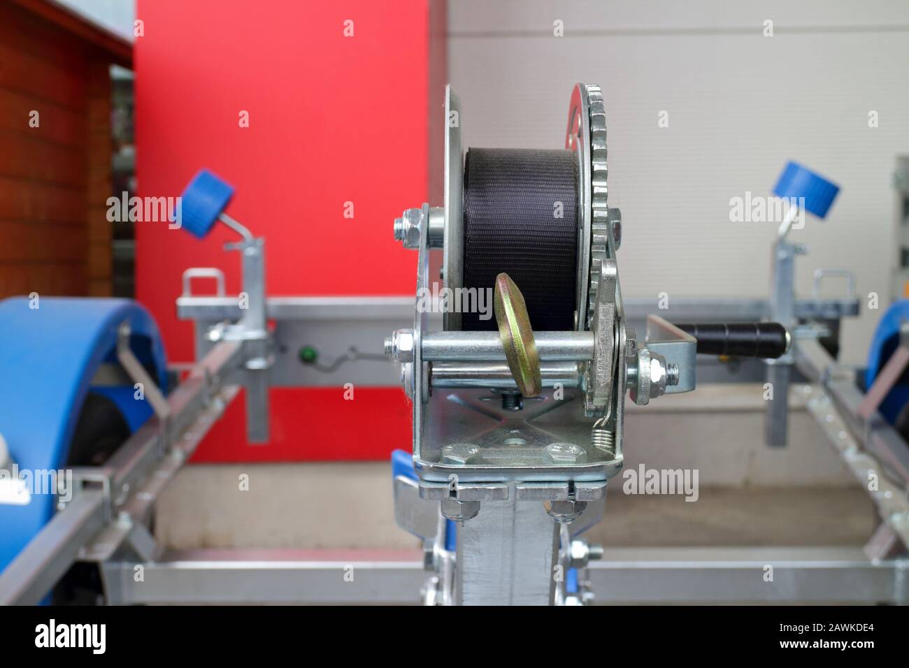 detail photo of the mechanical rope winch with hook on the trailer for ...