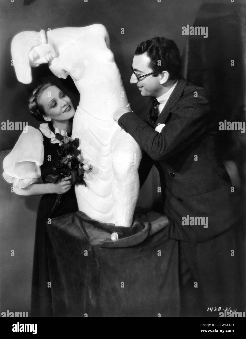 MARLENE DIETRICH and Director ROUBEN MAMOULIAN on set candid during ...