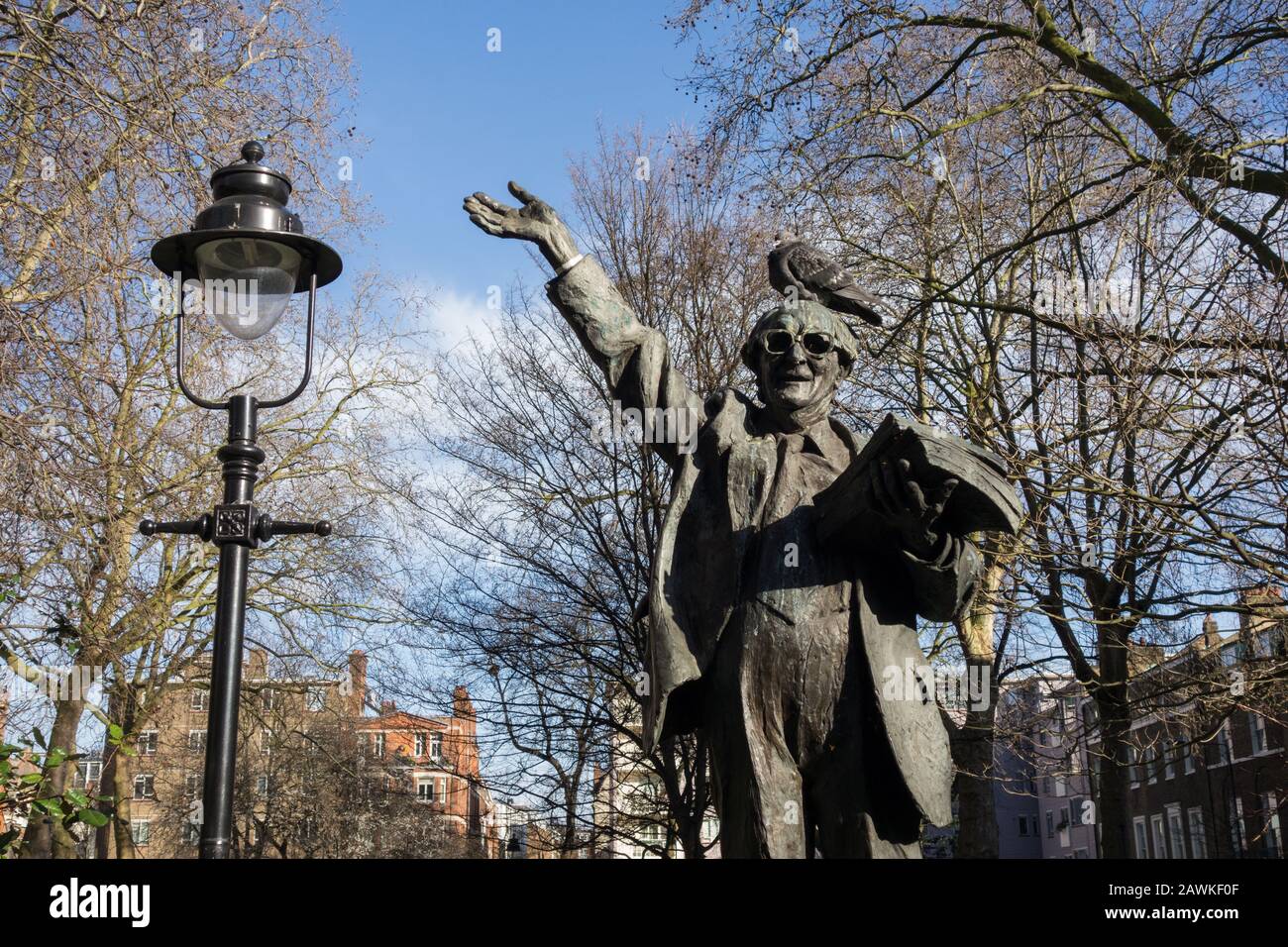 A pigeon sitting on a statue of Fenner Brockway, Baron Brockway, in Red ...