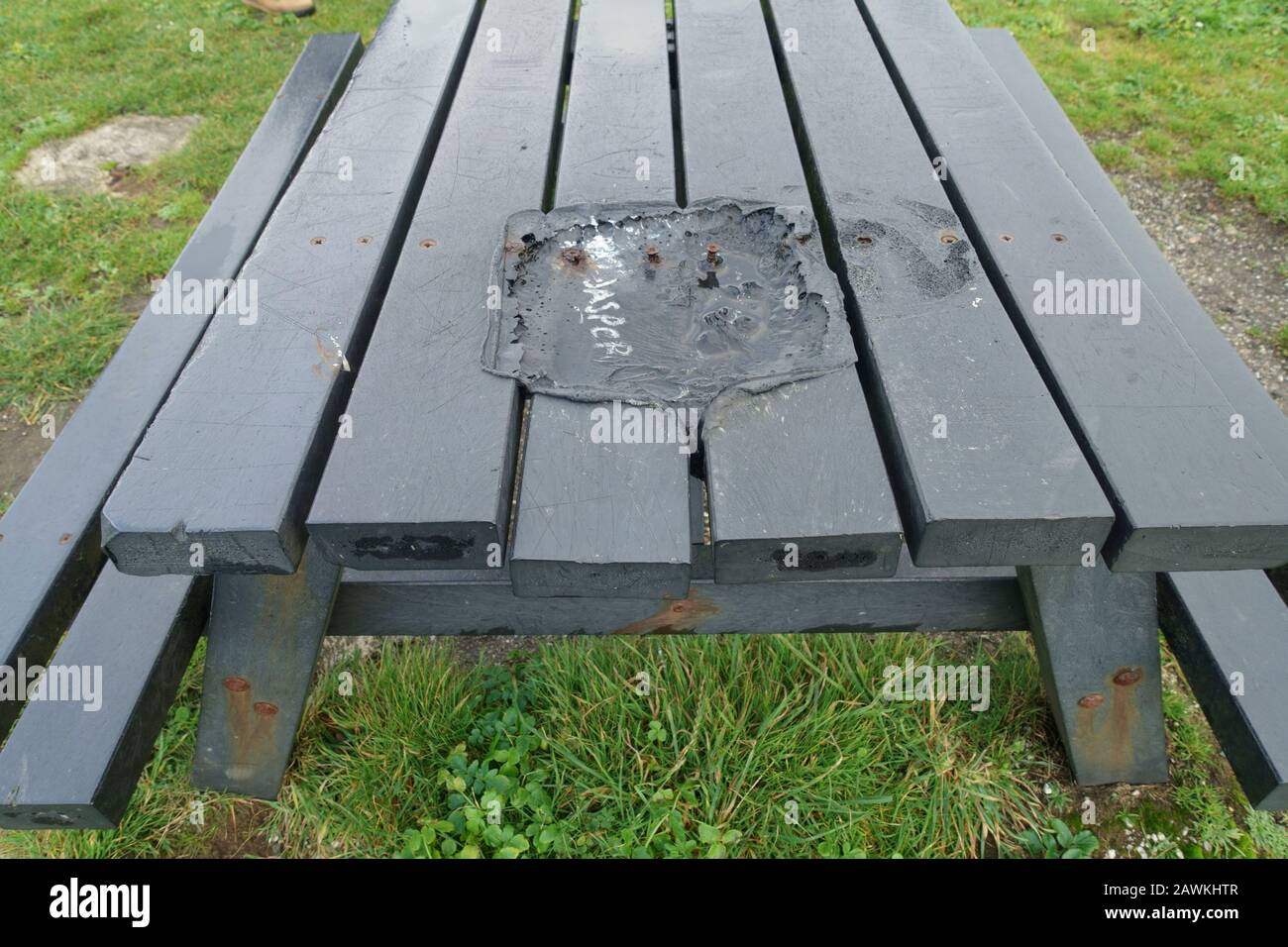 Plaswood picnic table damaged by Barbeque, Falmouth, UK Stock Photo - Alamy