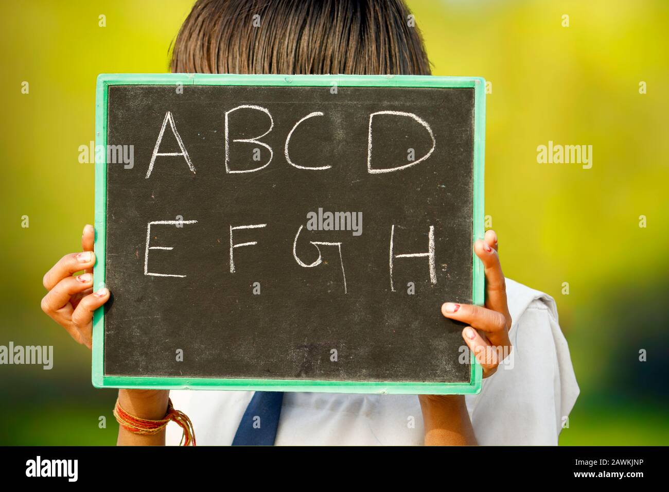 Sijhora India Feb 09. 2020 : Indian little girl face covered, holding ...
