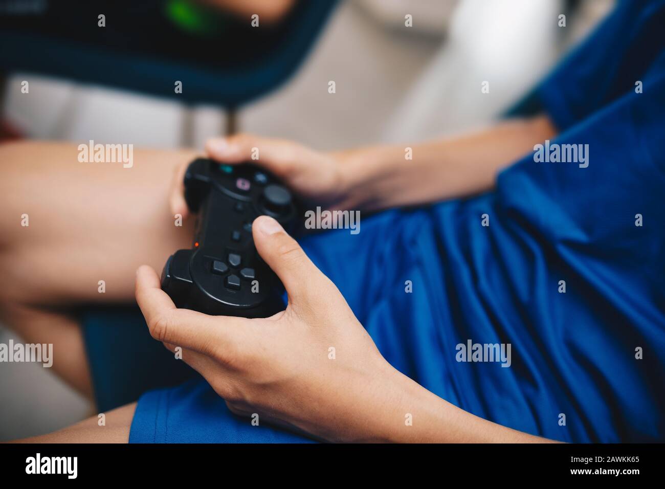 Boy plaiyng in computer game with joystick controller. Kid holding ...