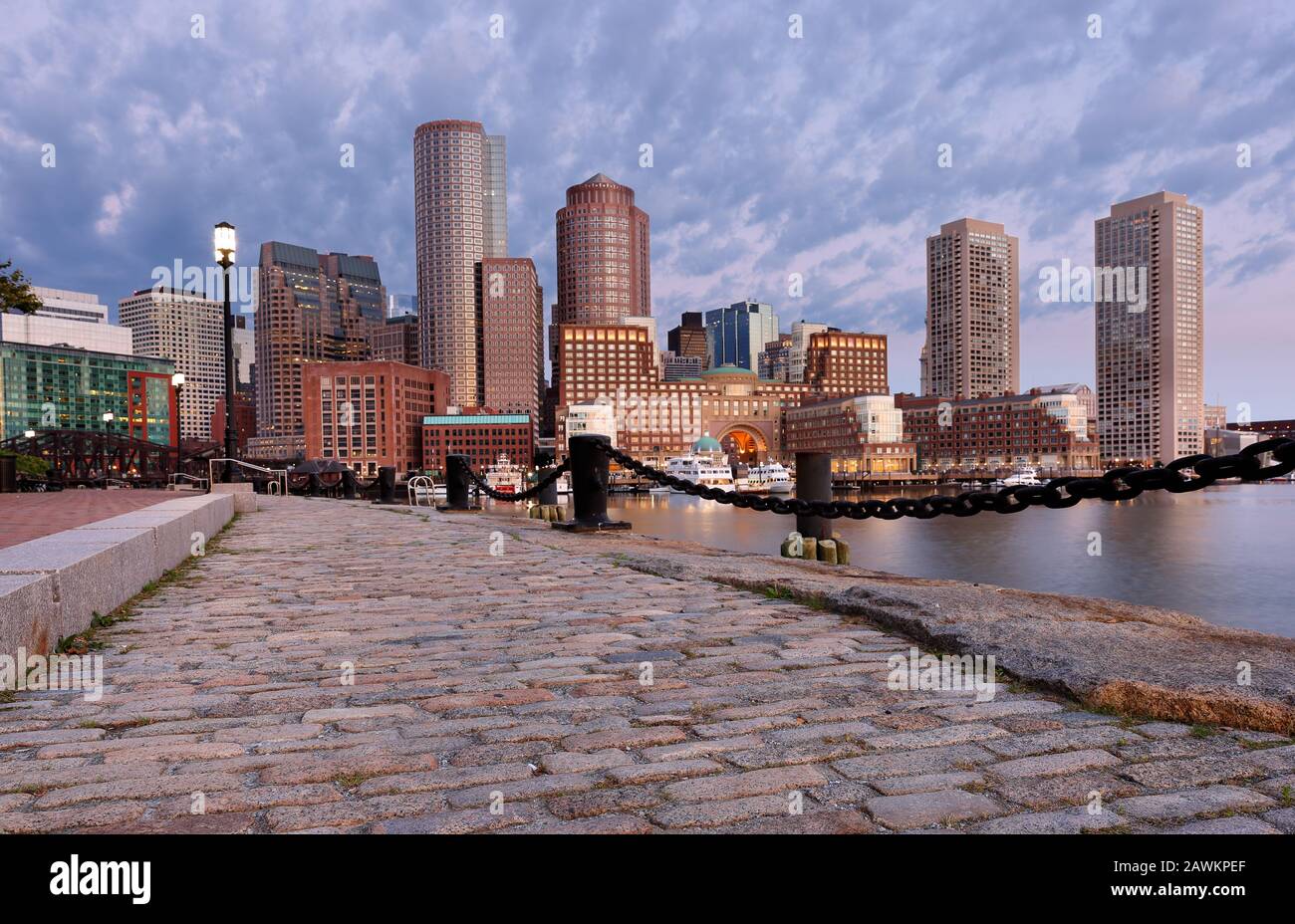 Boston Harbor at sunrise viewing from Fan Pier Park. Boston Harbor is a ...