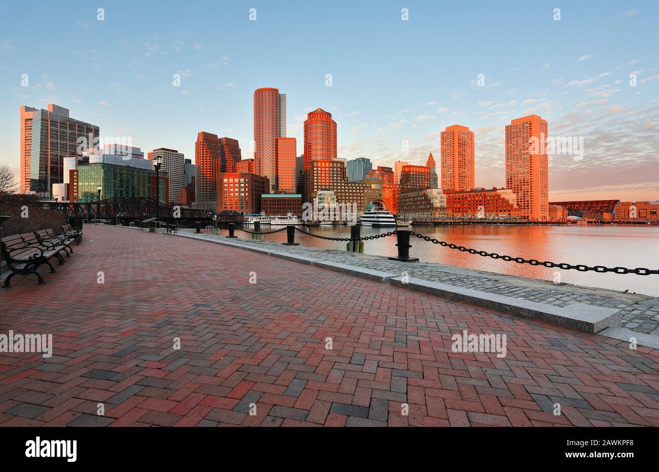 Boston Harbor at sunrise viewing from Fan Pier Park. Boston Harbor is a ...