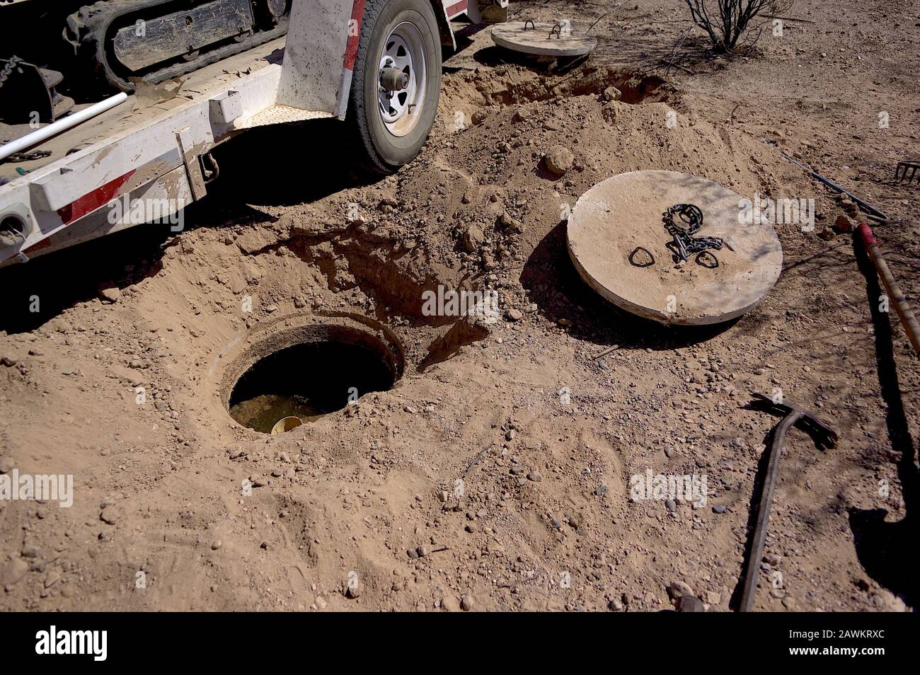 A septic tank with its lids uncovered in preparation of having the ...