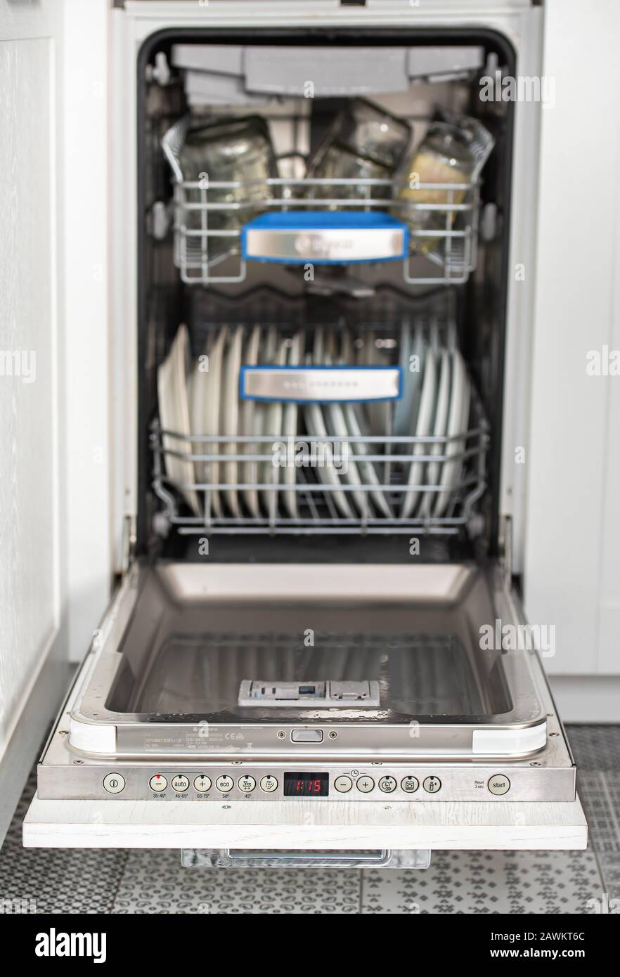 Open dishwasher with clean dishes in the white kitchen Stock Photo - Alamy