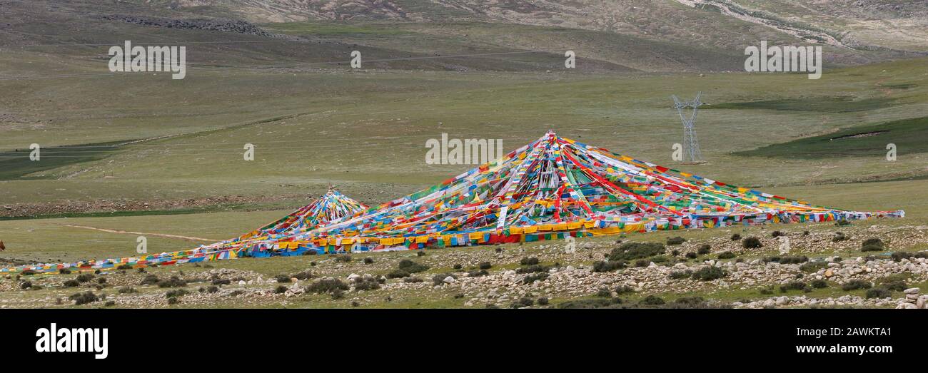 Panorama view on prayer flags tied together and shaped to a triangle ...
