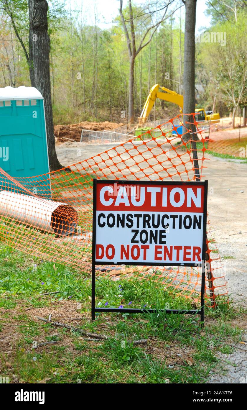 Caution - Construction Zone Sign in Front of Industrial Worksite Stock ...