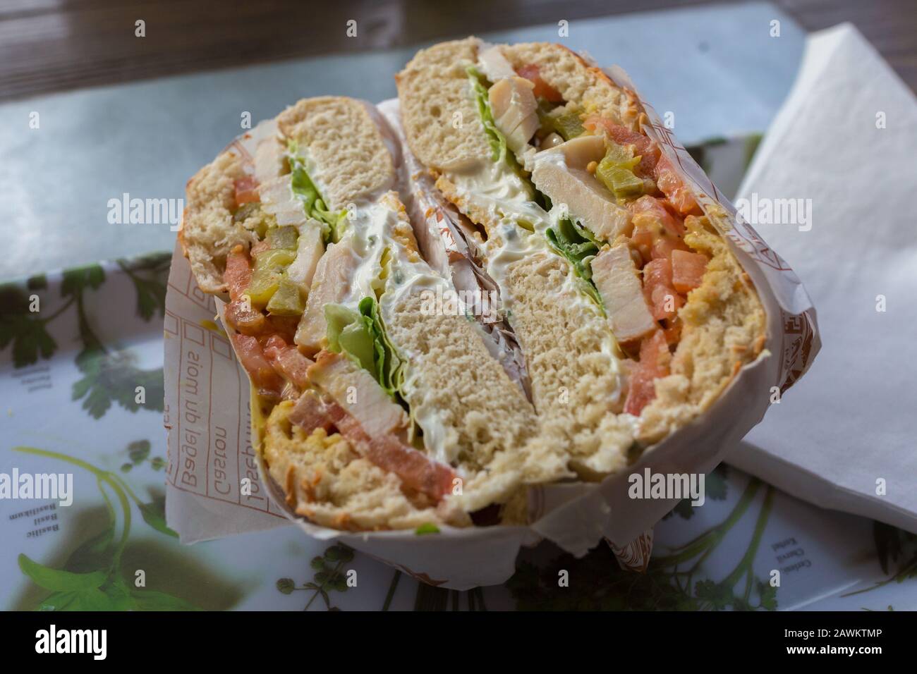 Close up of sliced bagel sandwich - cut in two halves - filled with ...