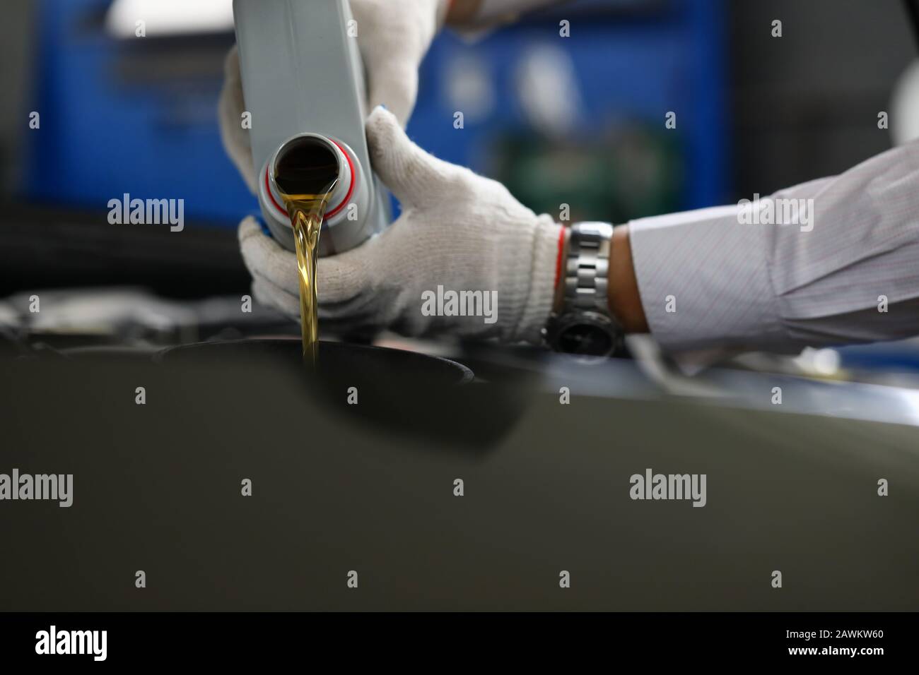 Timely replacement oil in car with new one oil Stock Photo - Alamy