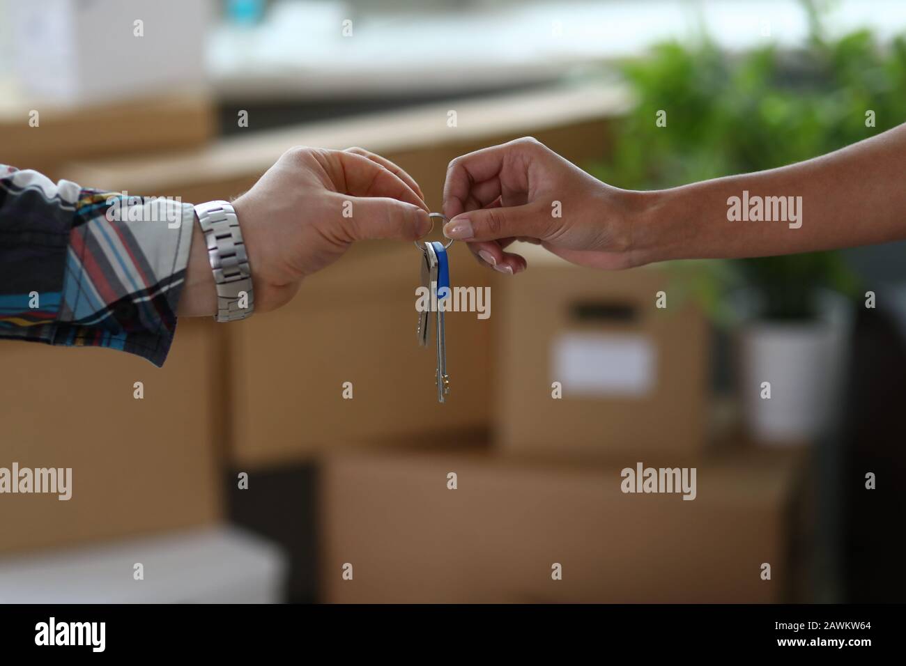 Moving to new apartment and receiving keys to it Stock Photo - Alamy