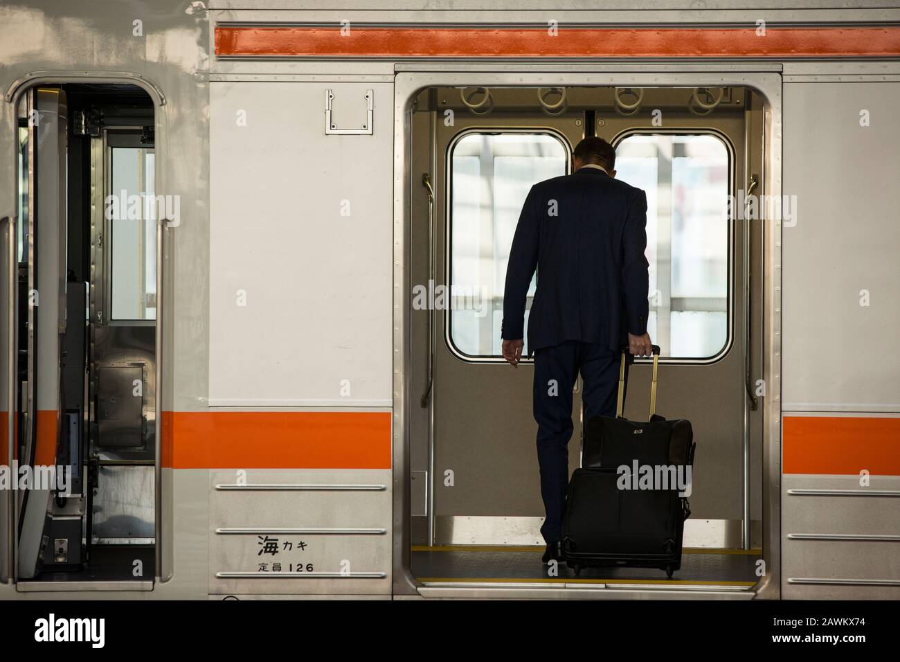 Man entering a train. Gifu, Japan Stock Photo - Alamy