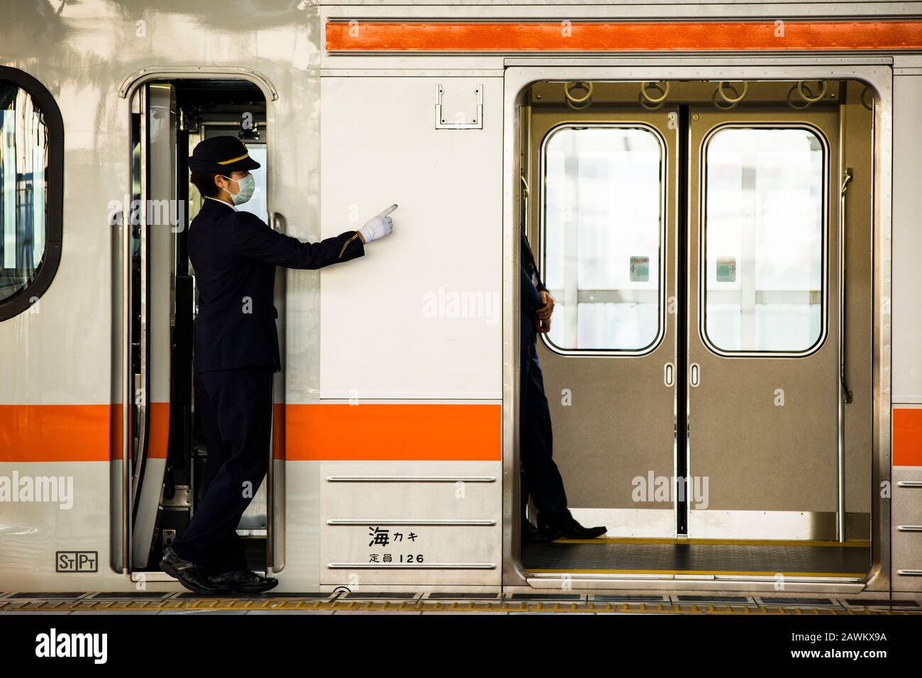 Train crew member signaling. Gifu, Japan Stock Photo - Alamy