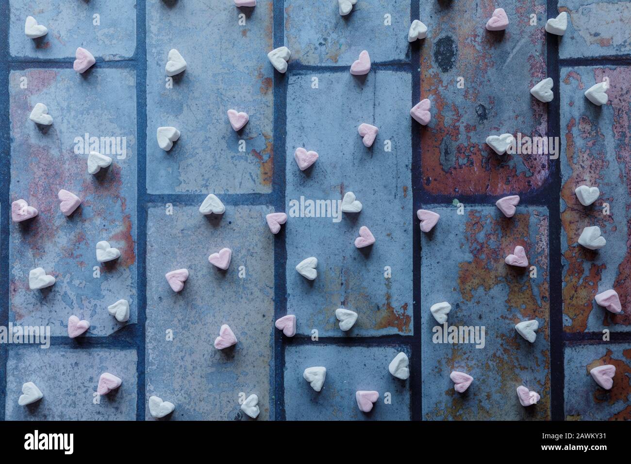 Heart shaped mashmallow's on an industrial tiled floor Stock Photo - Alamy