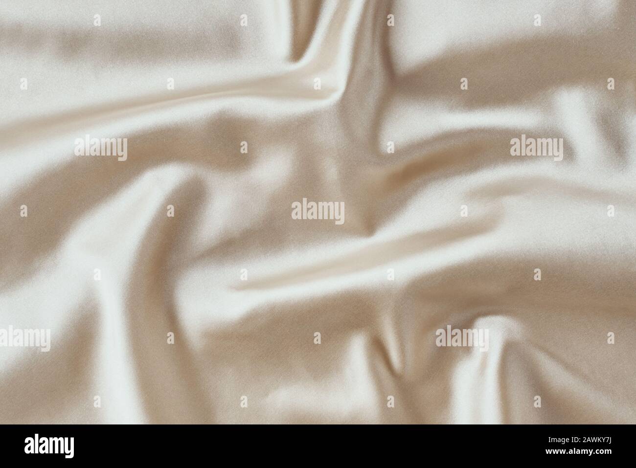 Golden light silk background with folds. Abstract texture of rippled ...