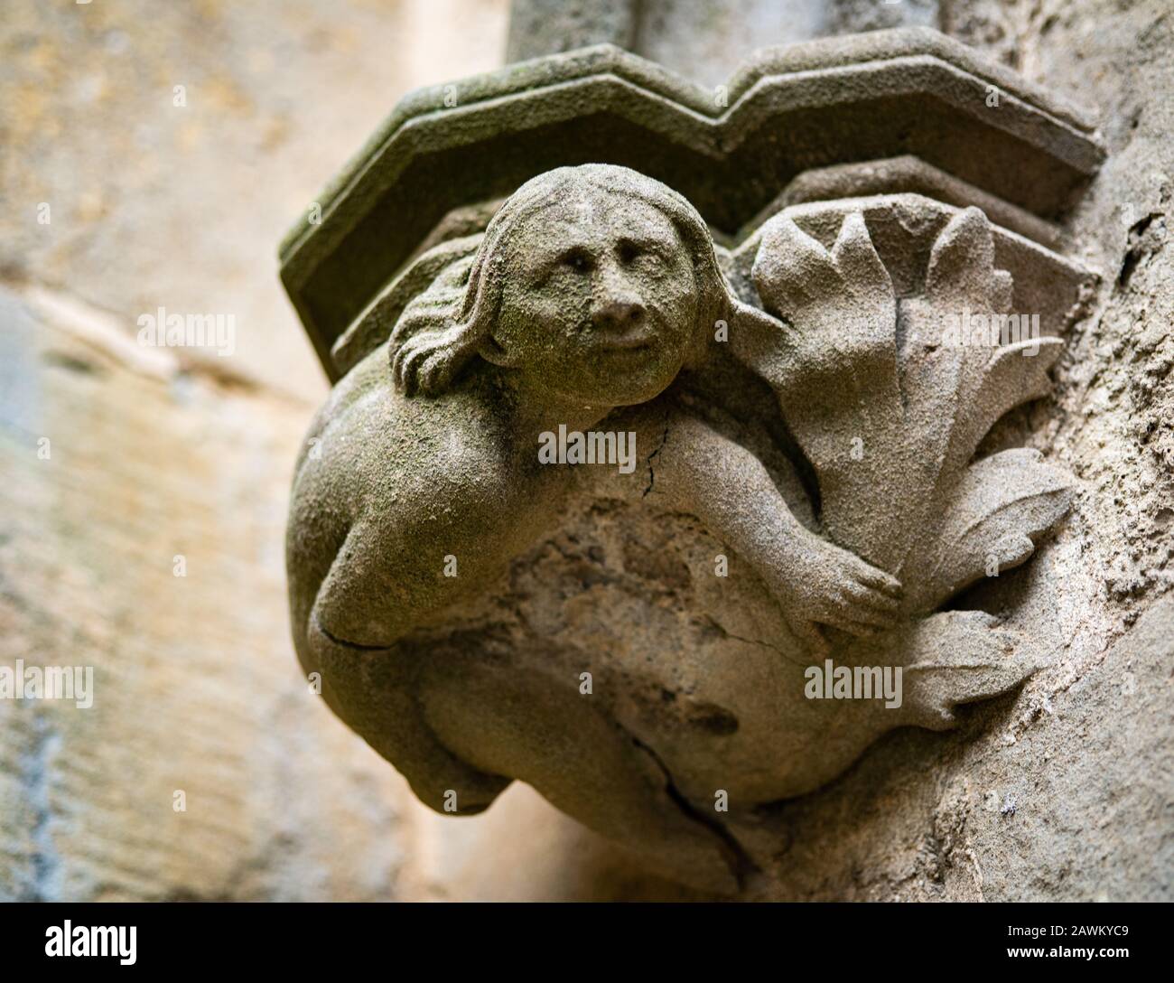 A Woman Carved At The Base Of A Stone Column Stock Photo - Alamy