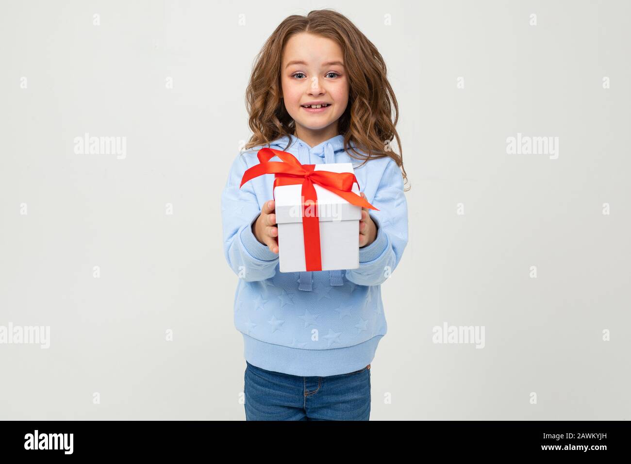happy girl received a birthday present on a white background Stock ...