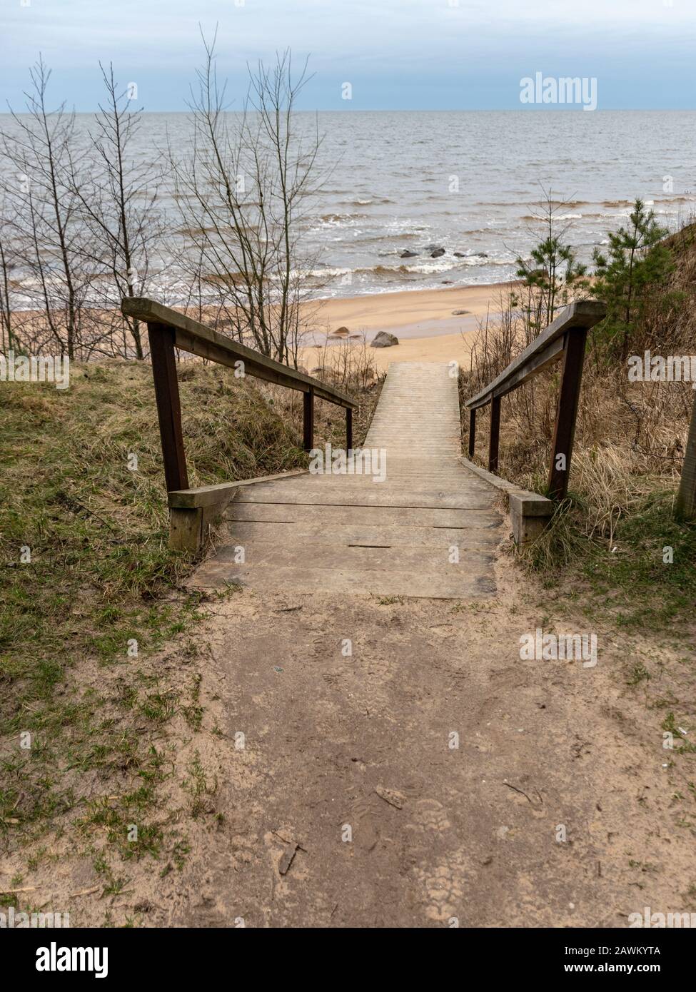 landscape with wooden stairs to the beach, steep sea shore Stock Photo ...